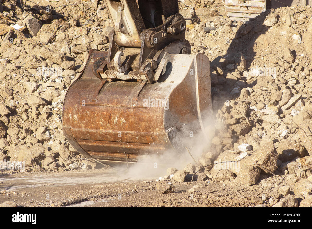 Close-up of a excavator bucket digging ground Stock Photo - Alamy