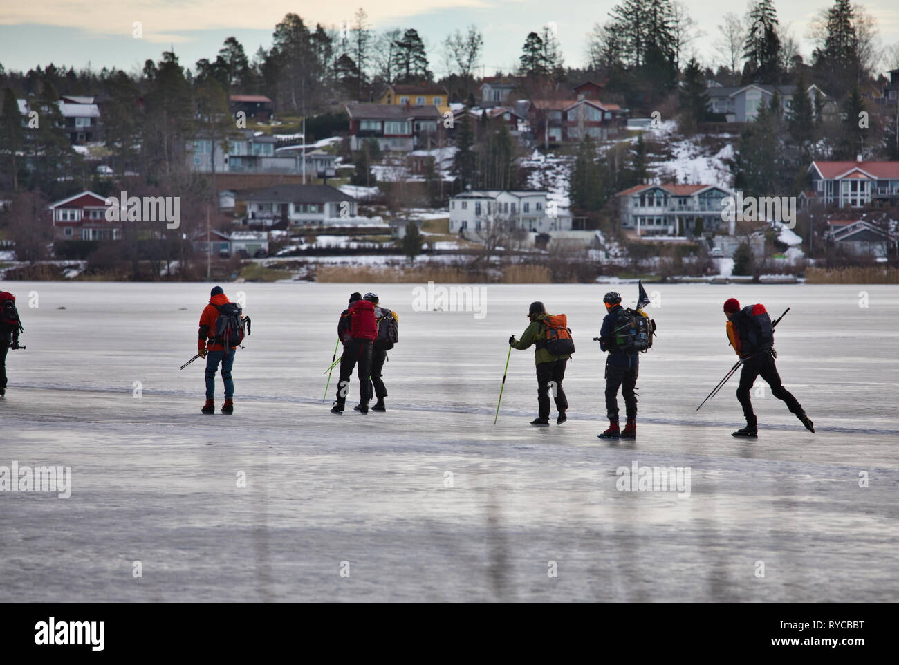 Long distance ice skaters on Lake Malaren, Sigtuna, Sweden, Scandinavia ...