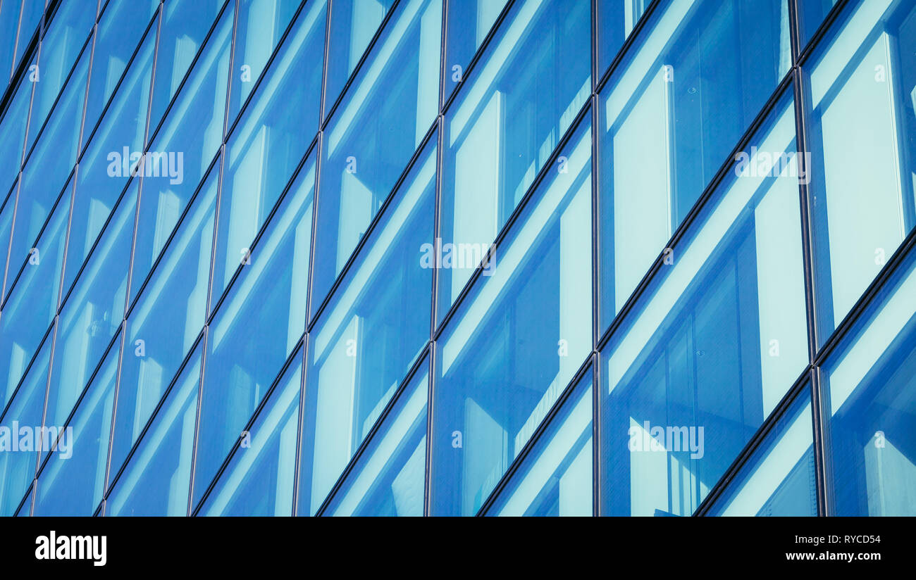 Modern office building: Skyscraper with blue glass Stock Photo - Alamy