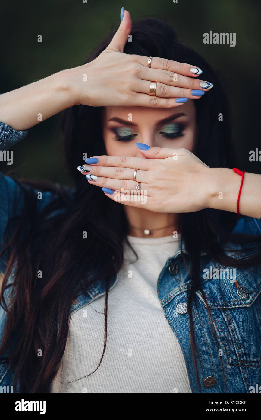 Front view of brunette posing with closed eyes Stock Photo - Alamy