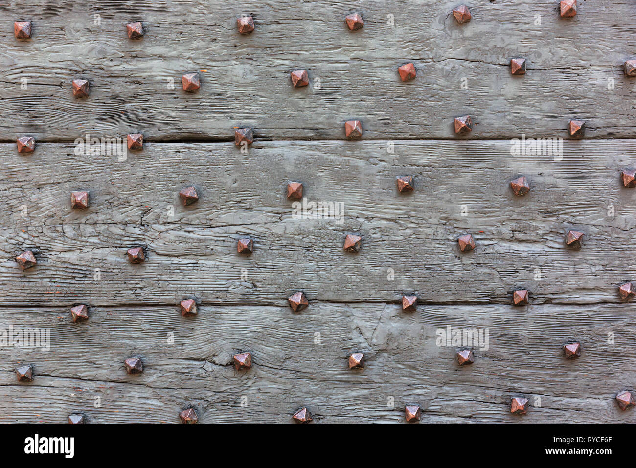 texture of the old wooden gate with copper thorn Stock Photo - Alamy
