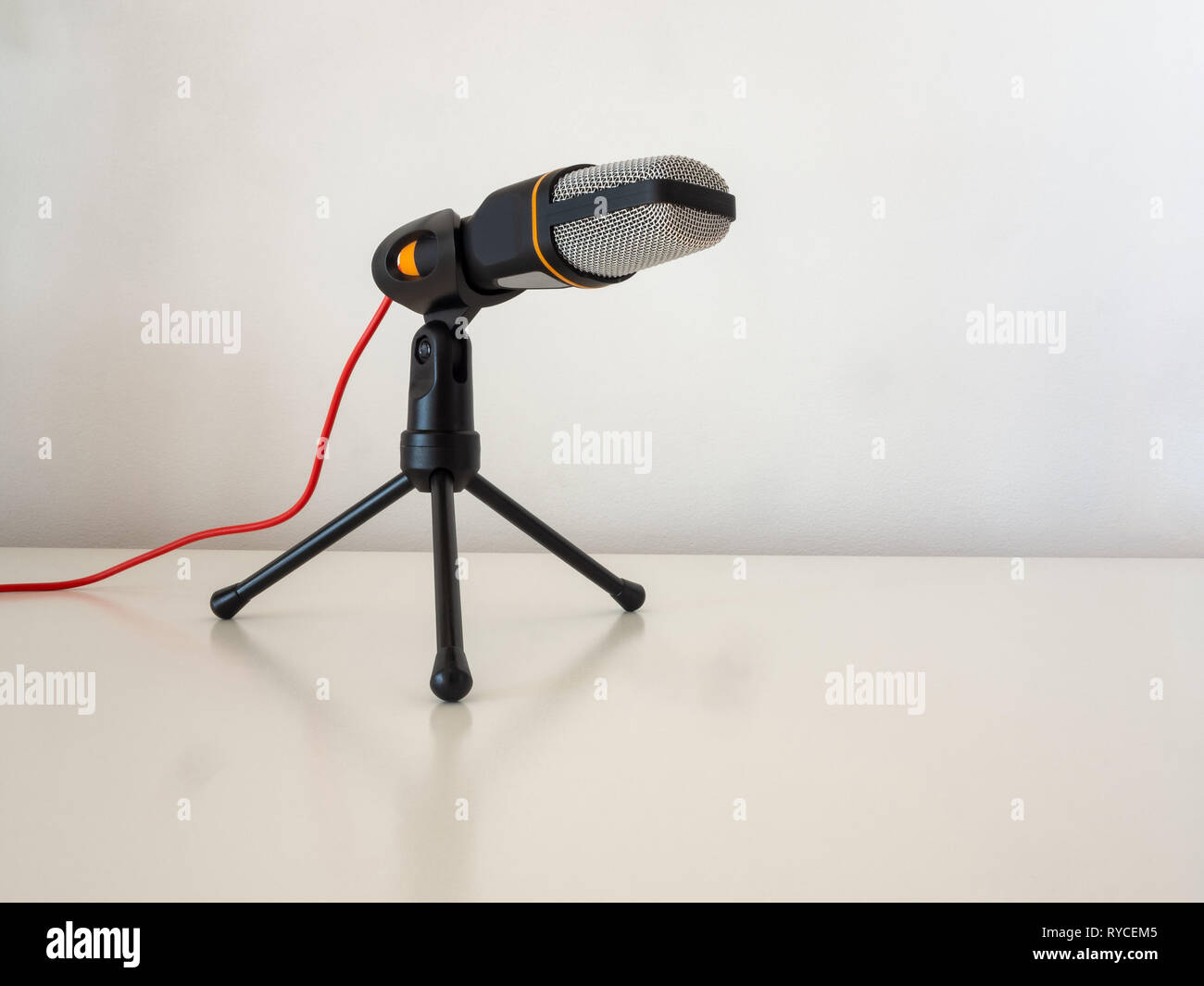 Microphone on a white table. Recording and broadcast concepts Stock ...