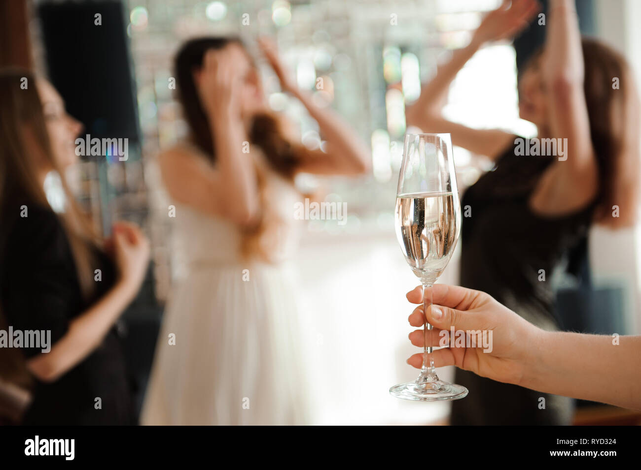Group people with champagne dancing at the party Stock Photo - Alamy