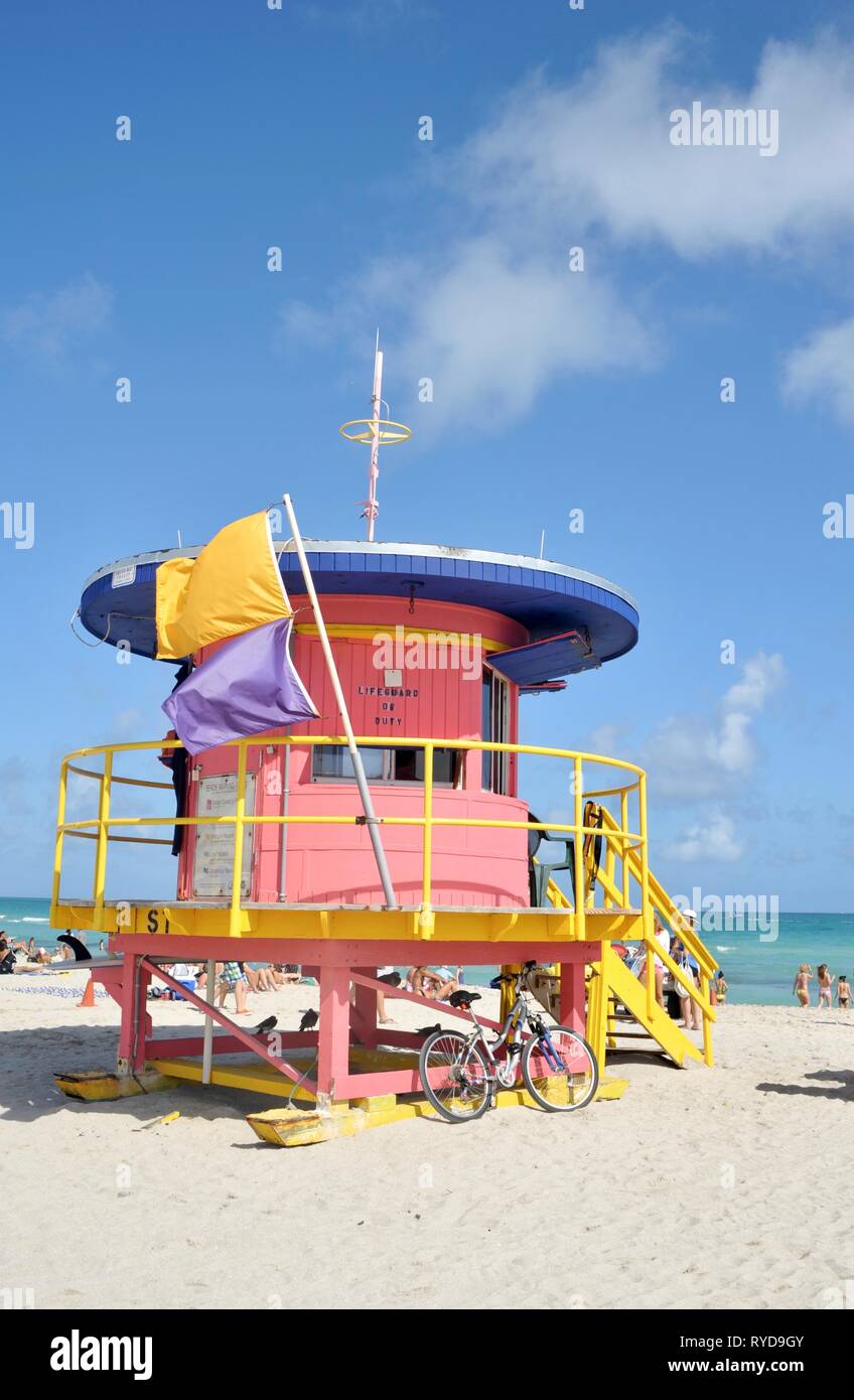 Colorfully painted Art Deco lifeguard station on sunny South Beach with ...