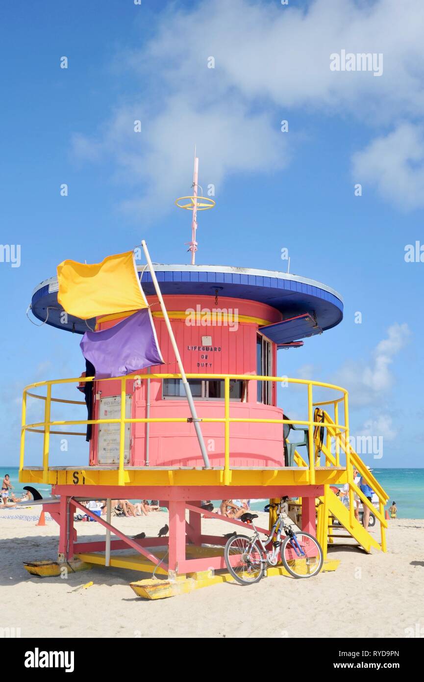 Colorfully painted Art Deco lifeguard station on sunny South Beach with ...