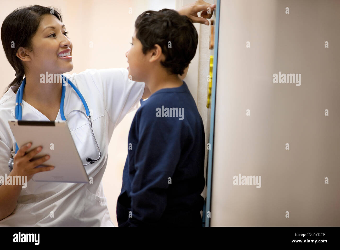 Nurse measuring height hi-res stock photography and images - Alamy