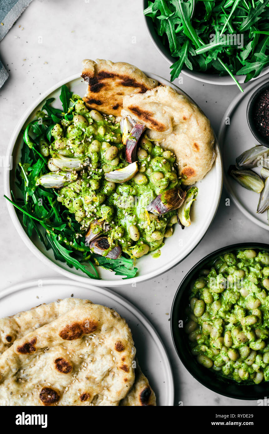 Persian Herb and White Bean Salad with Naan Stock Photo - Alamy