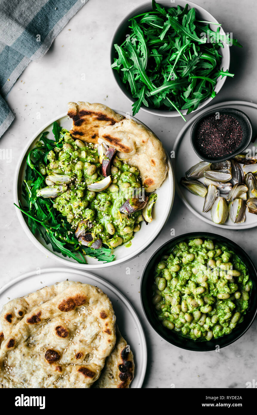 Persian Herb and White Bean Salad with Naan Stock Photo - Alamy