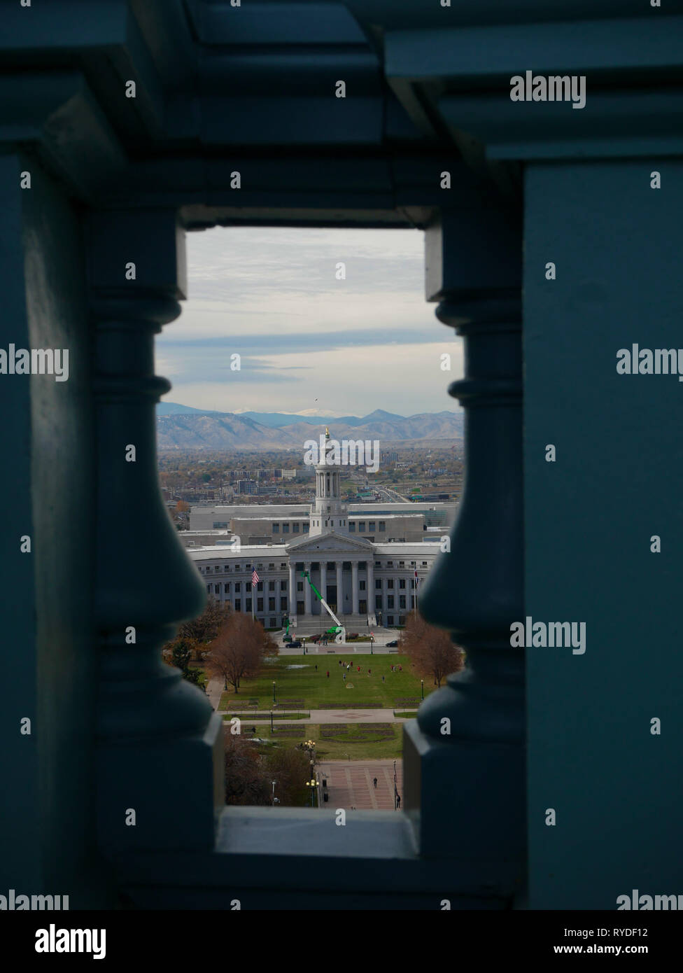 Looking through the railing of the Denver capitol building towards ...