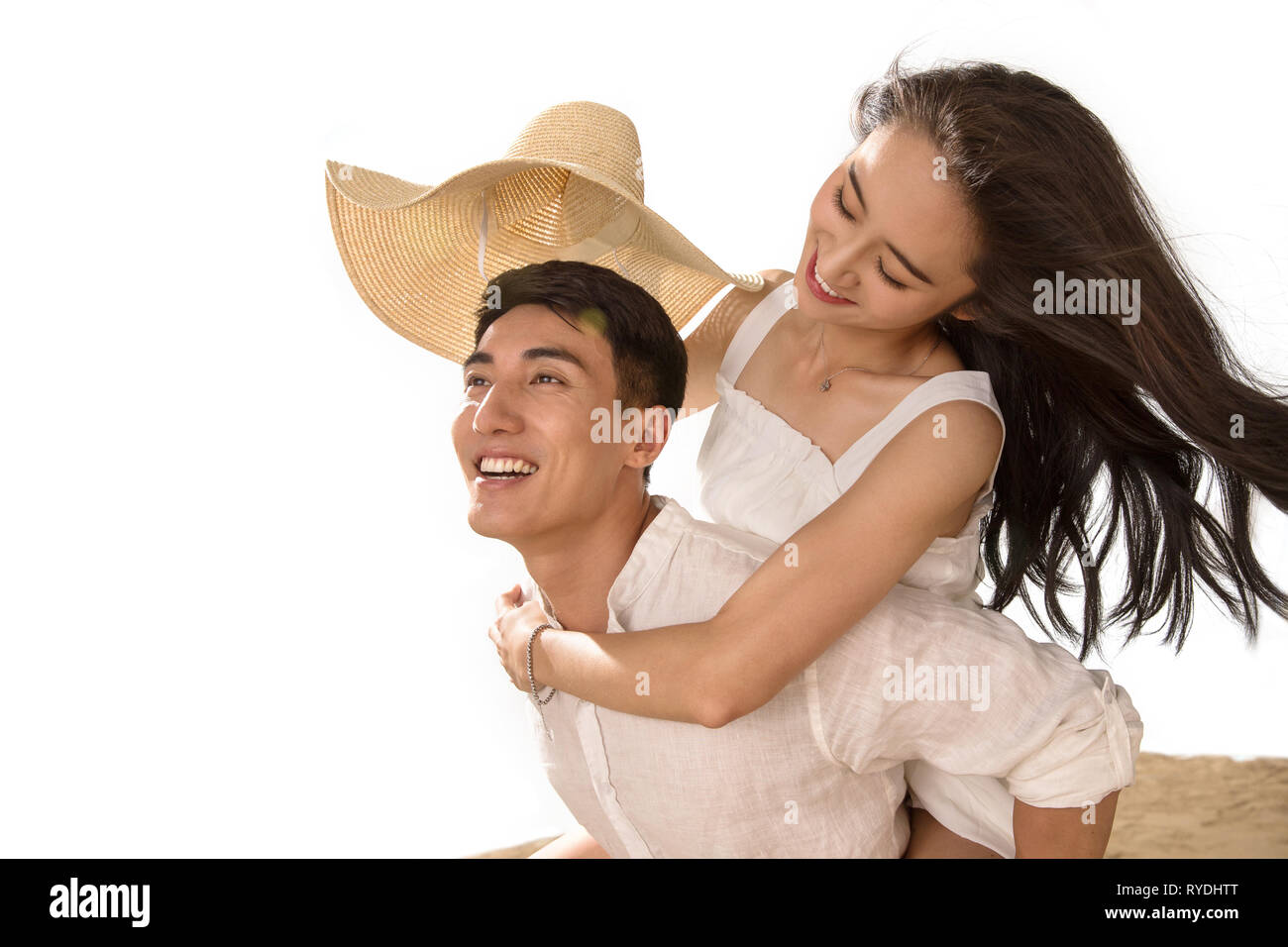 Young lovers play on the beach Stock Photo - Alamy