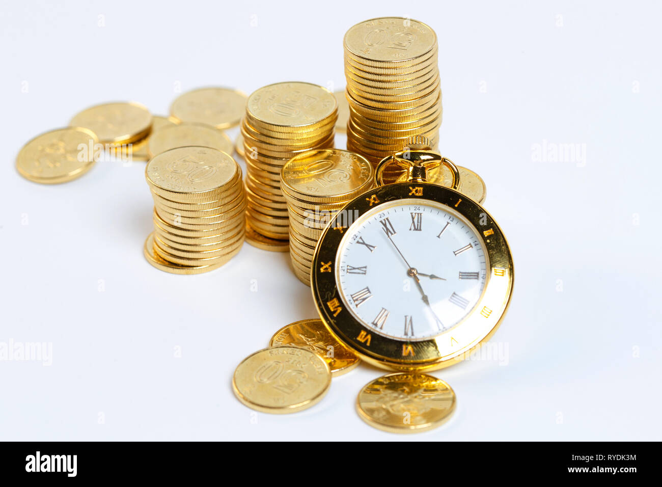 Clock and COINS Stock Photo - Alamy