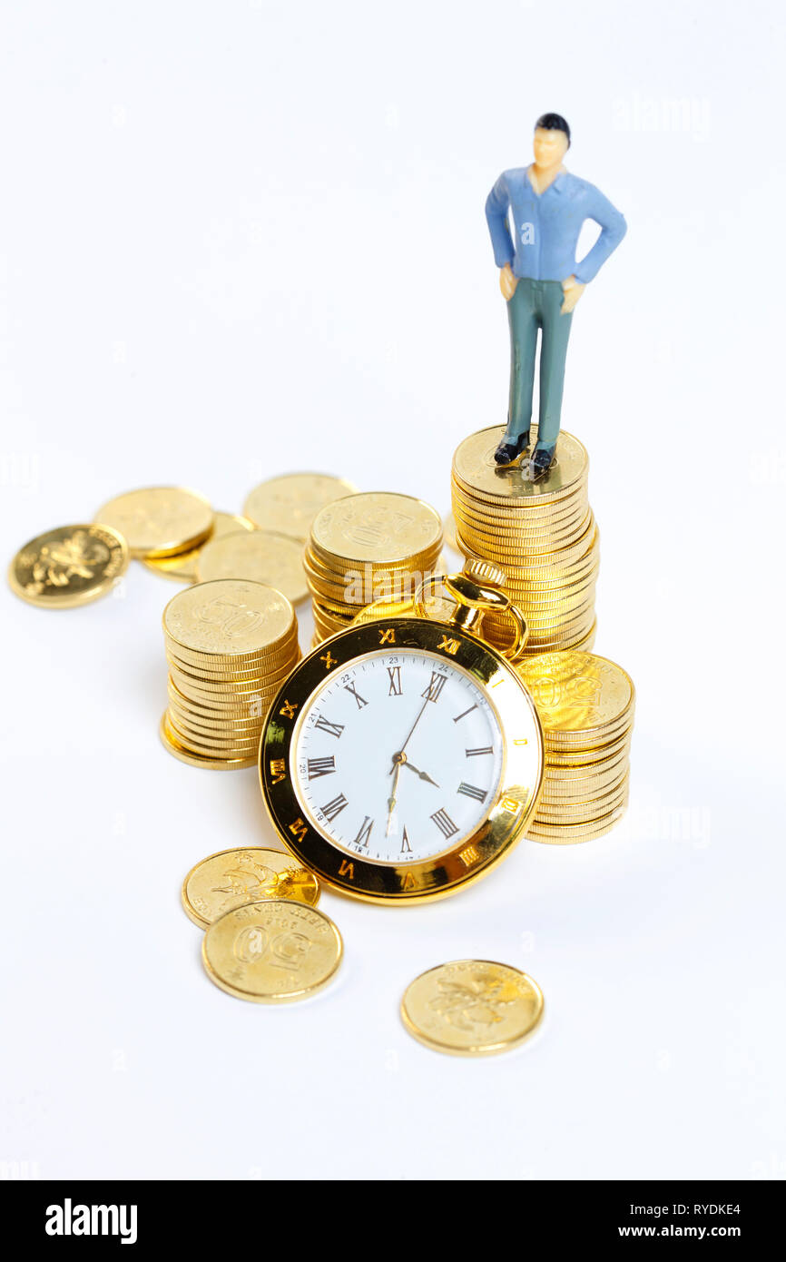 Gold COINS and clock Stock Photo - Alamy