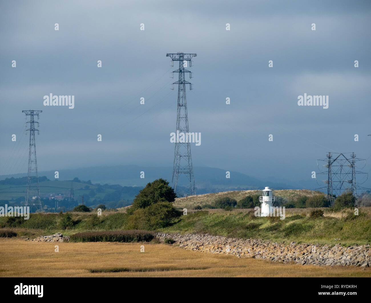 East Usk lighthouse at Newport Wetlands Nature Reserve with pylons of ...