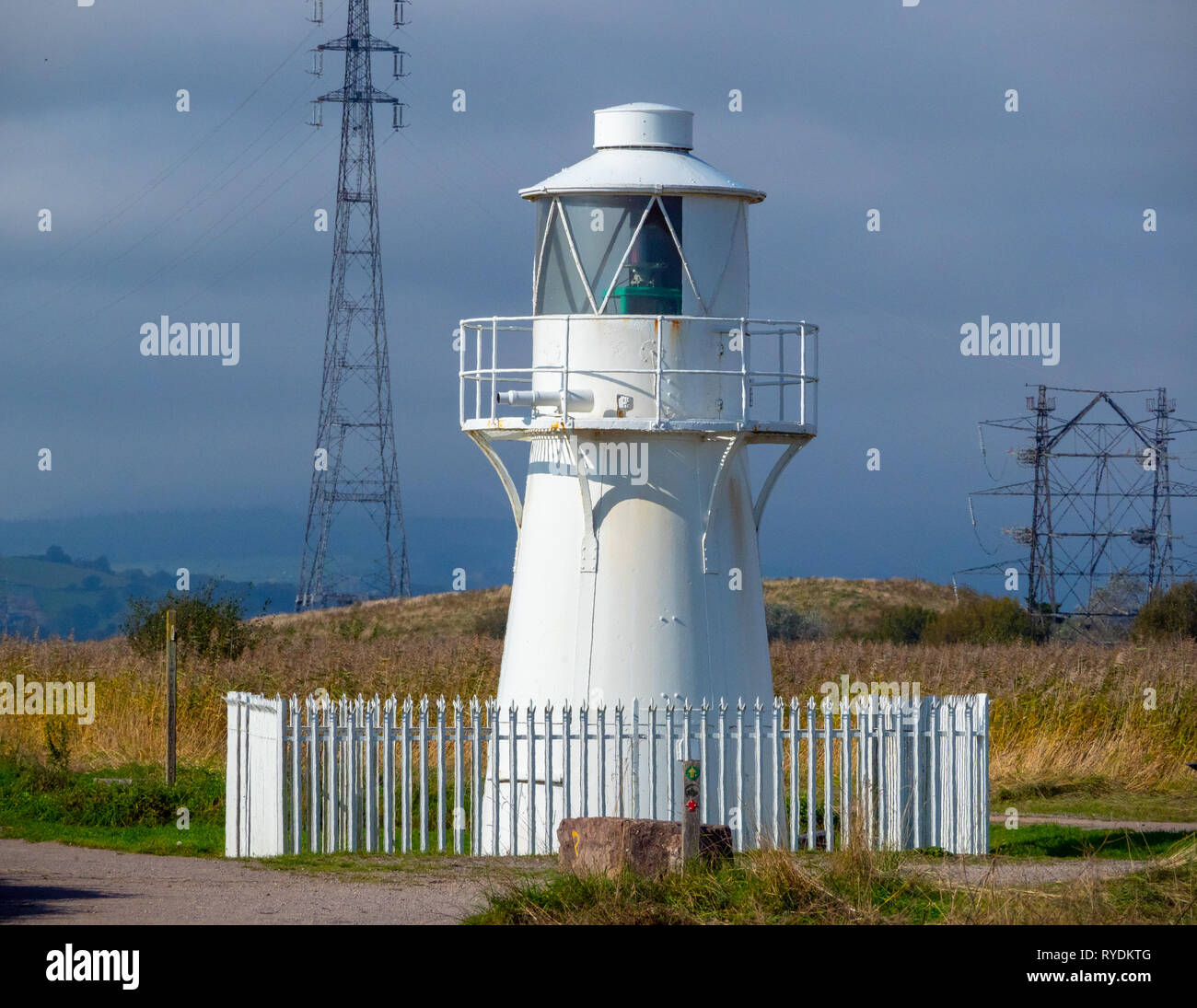 East Usk lighthouse at Newport Wetlands Nature Reserve with pylons of ...
