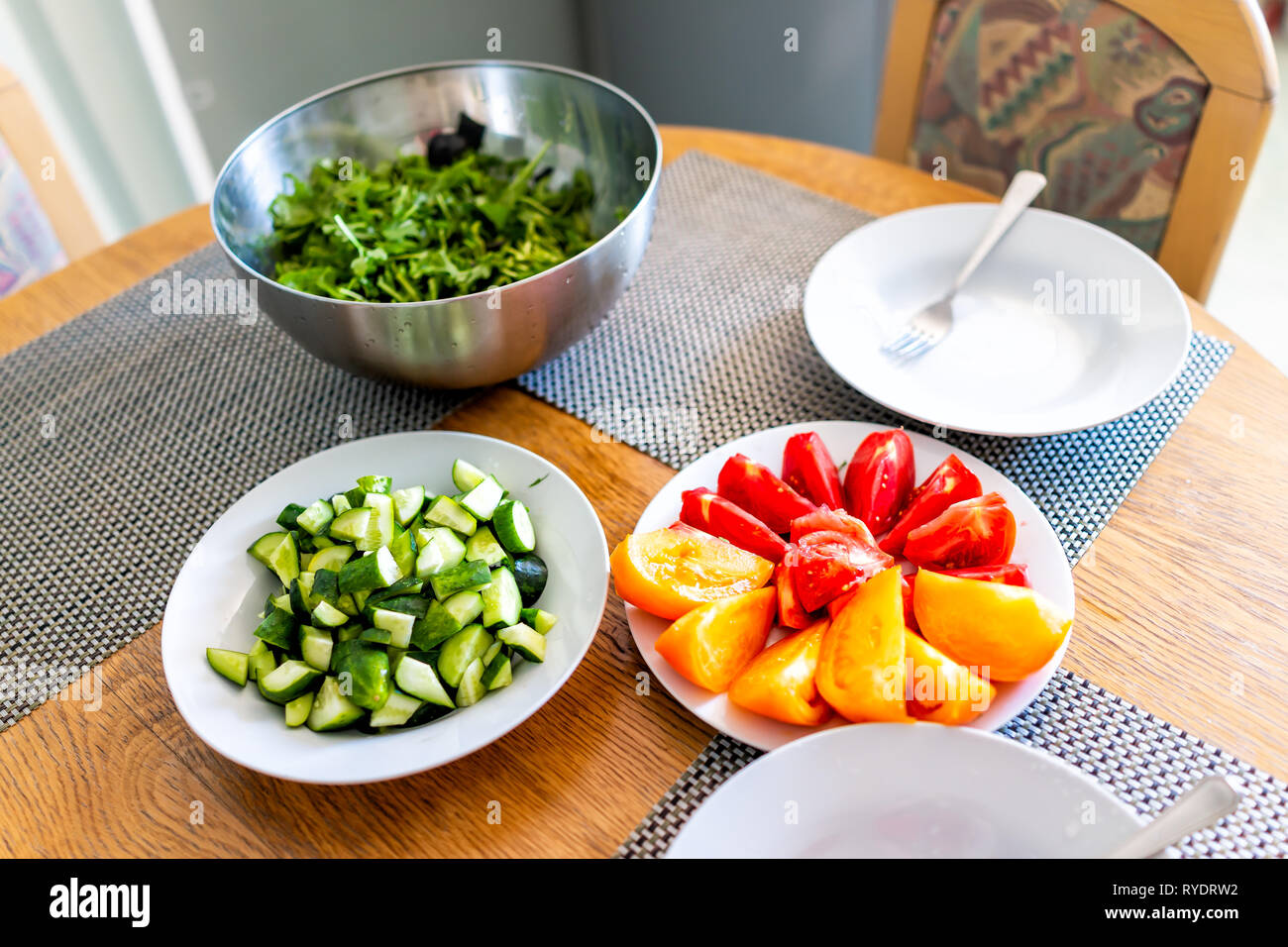 Wooden table with setting of healthy vegan lunch or dinner and green ...