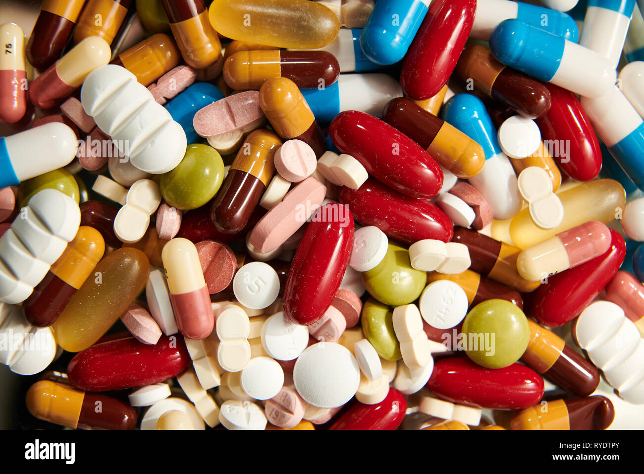 Different colored medicine and types of pills. Medical health or drugs ...