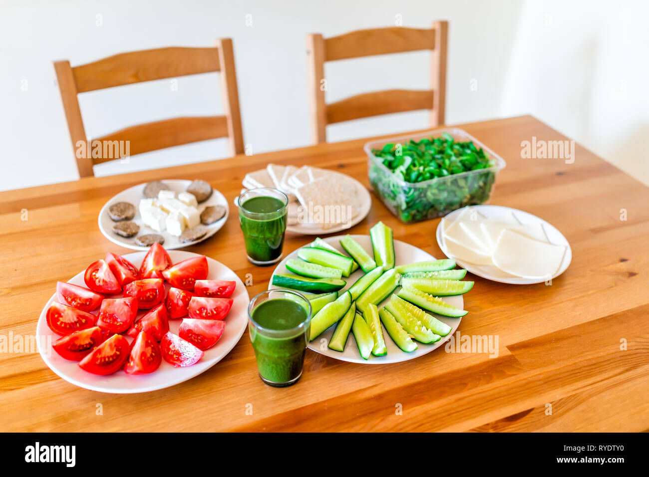 Wooden table with food setting of healthy vegan vegetarian lunch or ...