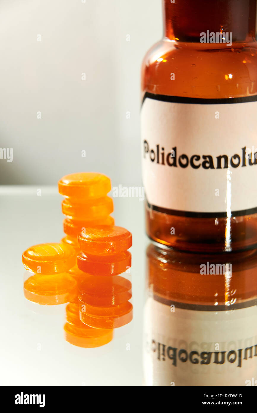 orange drug bottle with pastills Stock Photo - Alamy