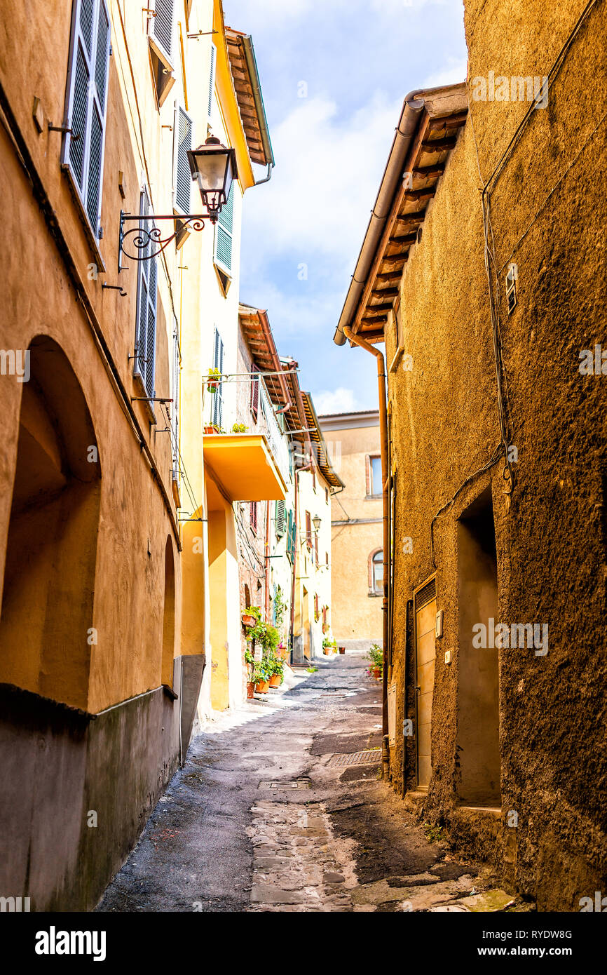 Chiusi, Italy dark narrow street alley in small historic medieval town ...