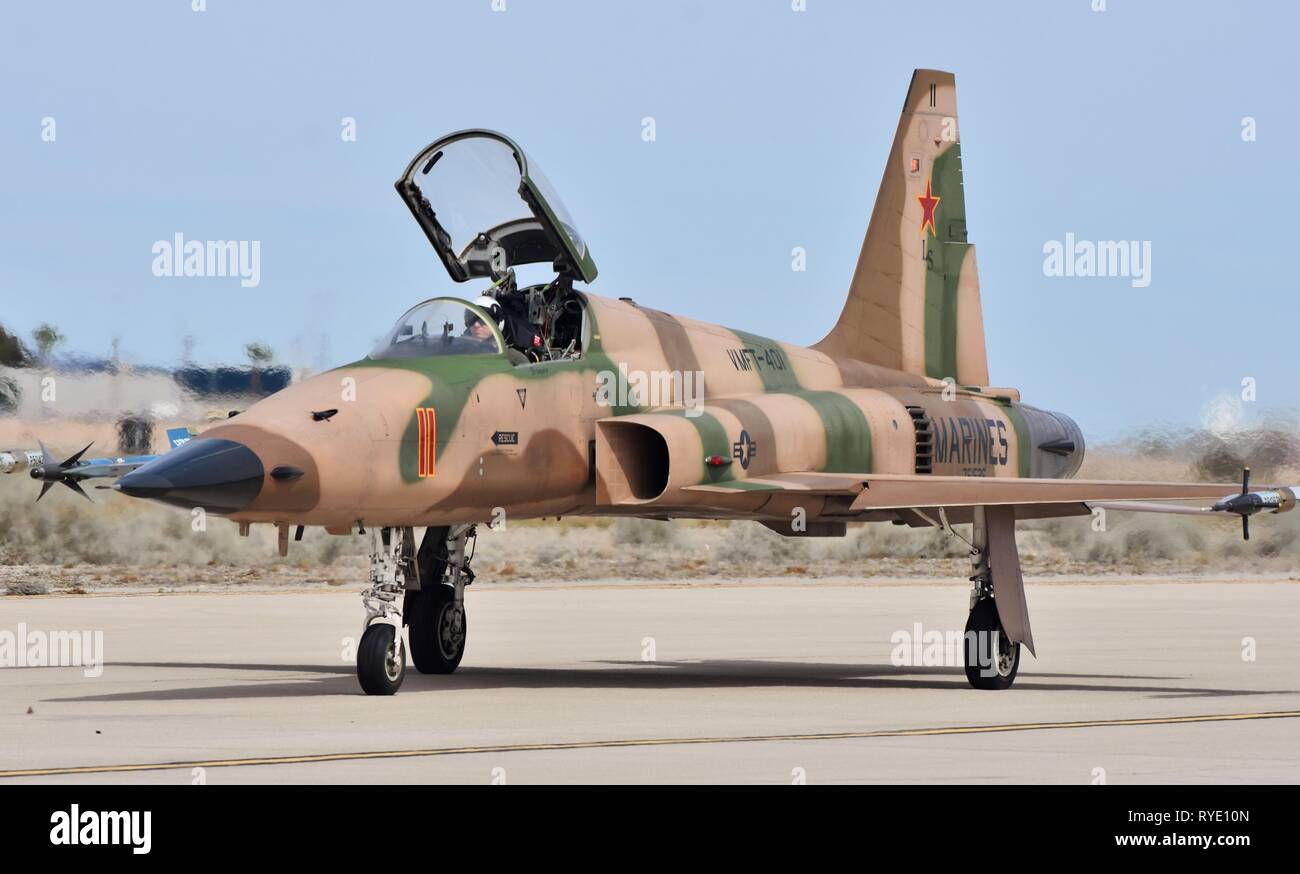 A Marine Corps F-5 Tiger fighter jet taxiing on a runway at MCAS Yuma ...