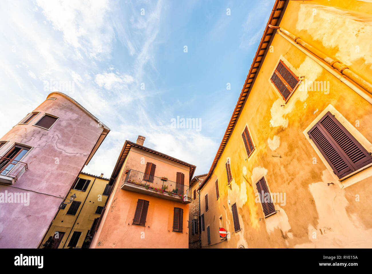Chiusi, Italy orange yellow bright vibrant colorful walls at sunset ...