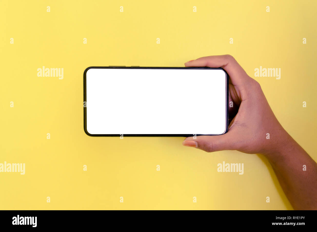 Human hand holding smartphone with white screen background, Mobile ...