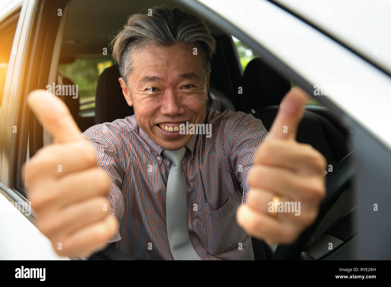 Senior asian man driving old hi-res stock photography and images - Alamy