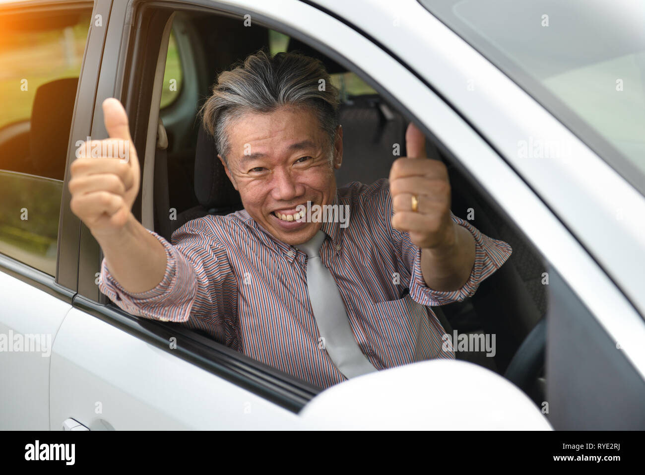 Senior asian man driving old hi-res stock photography and images - Alamy