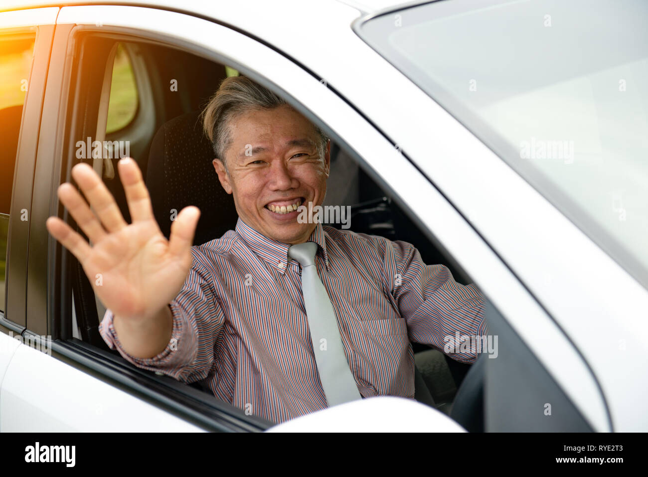 Senior asian man driving old hi-res stock photography and images - Alamy