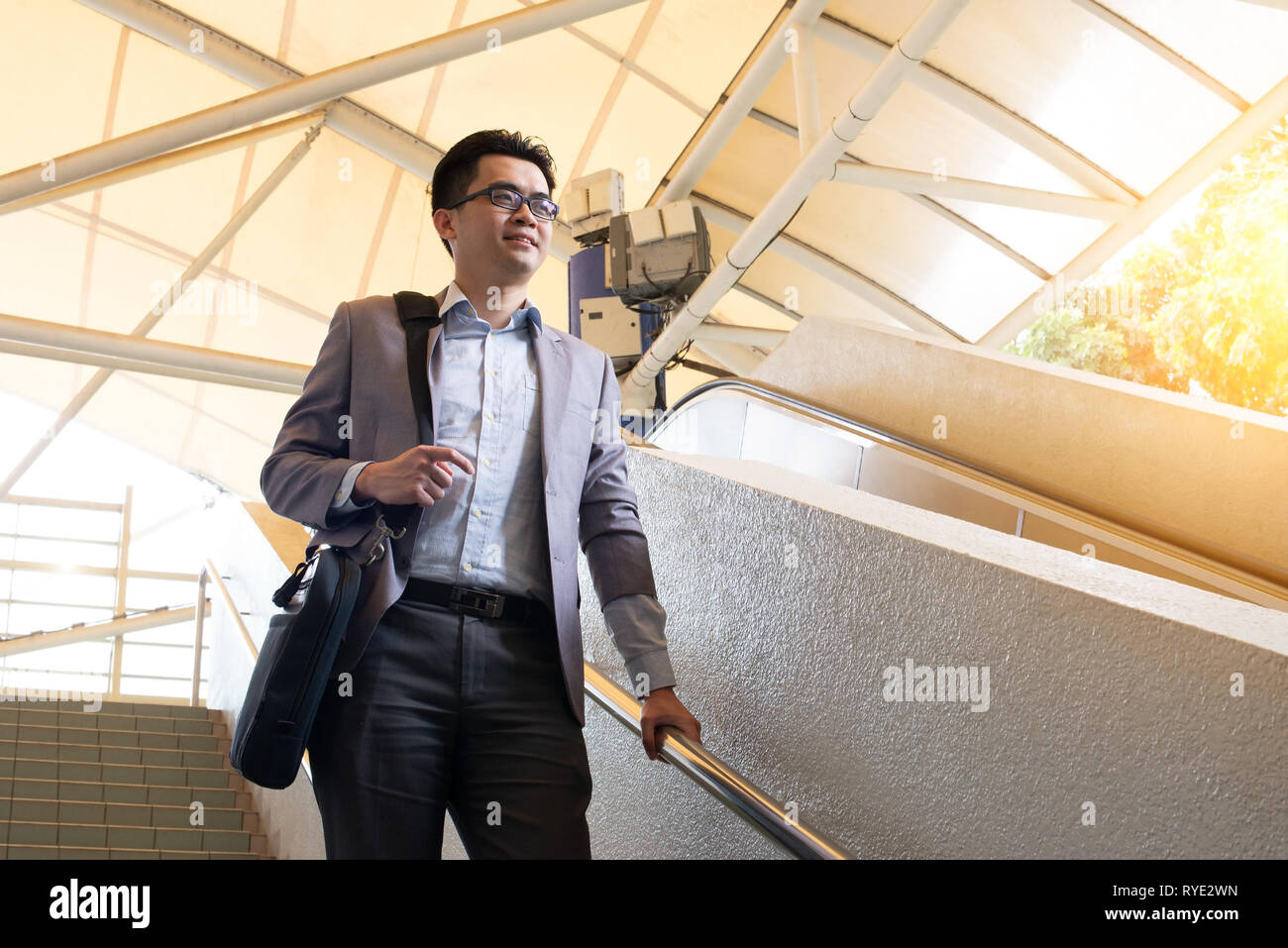 urban asian business man travelling on train Stock Photo - Alamy