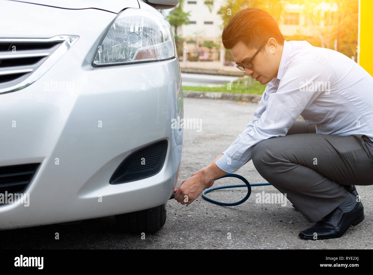 Pumping tire station compressor hi-res stock photography and images - Alamy