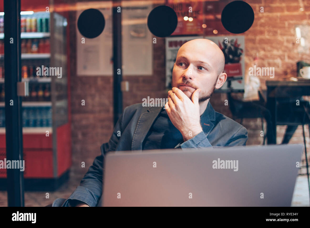 Thinking Attractive Adult Successful Bald Bearded Man In Suit With