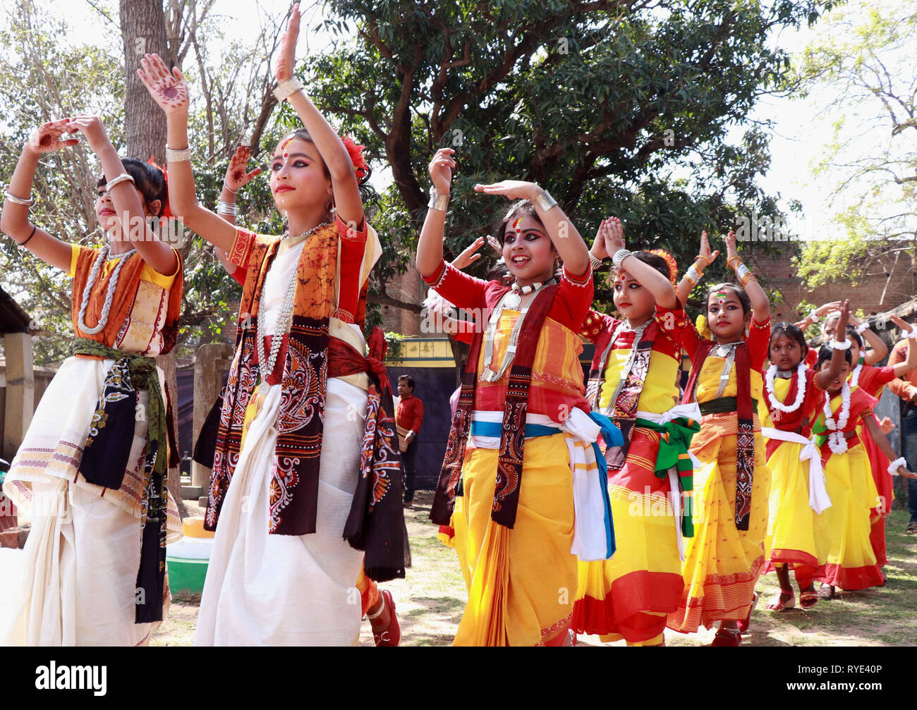 Bolpur, India. 13th Mar, 2019. Students of a school performing dance during celebrating ‘Basanta ...