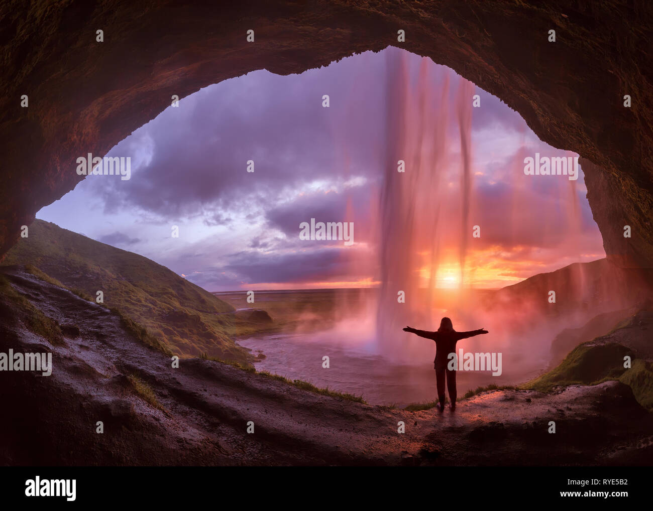 Iceland landscape photo of adventurous girl with his arms raised who ...
