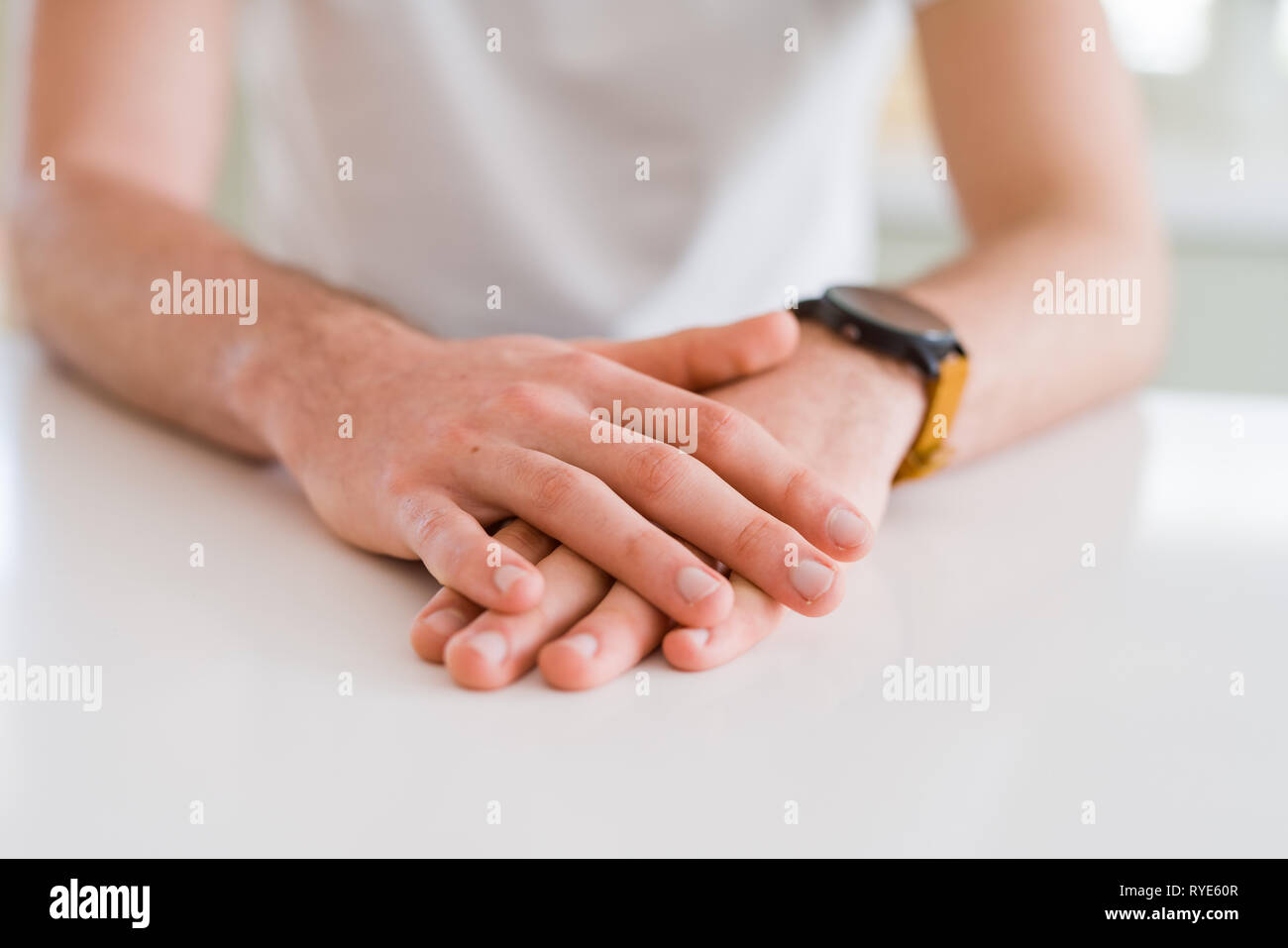 Close up young man hands together Stock Photo - Alamy