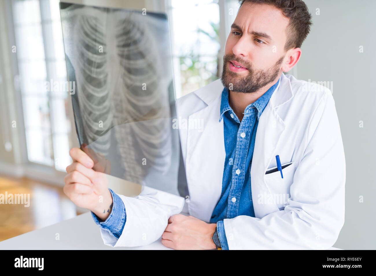 Doctor man looking at x-ray radiography doing body examination Stock ...