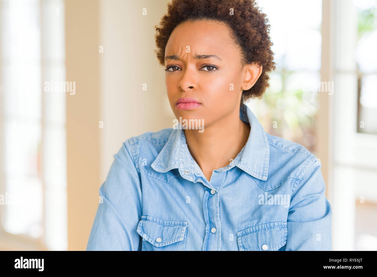 Young beautiful african american woman skeptic and nervous ...
