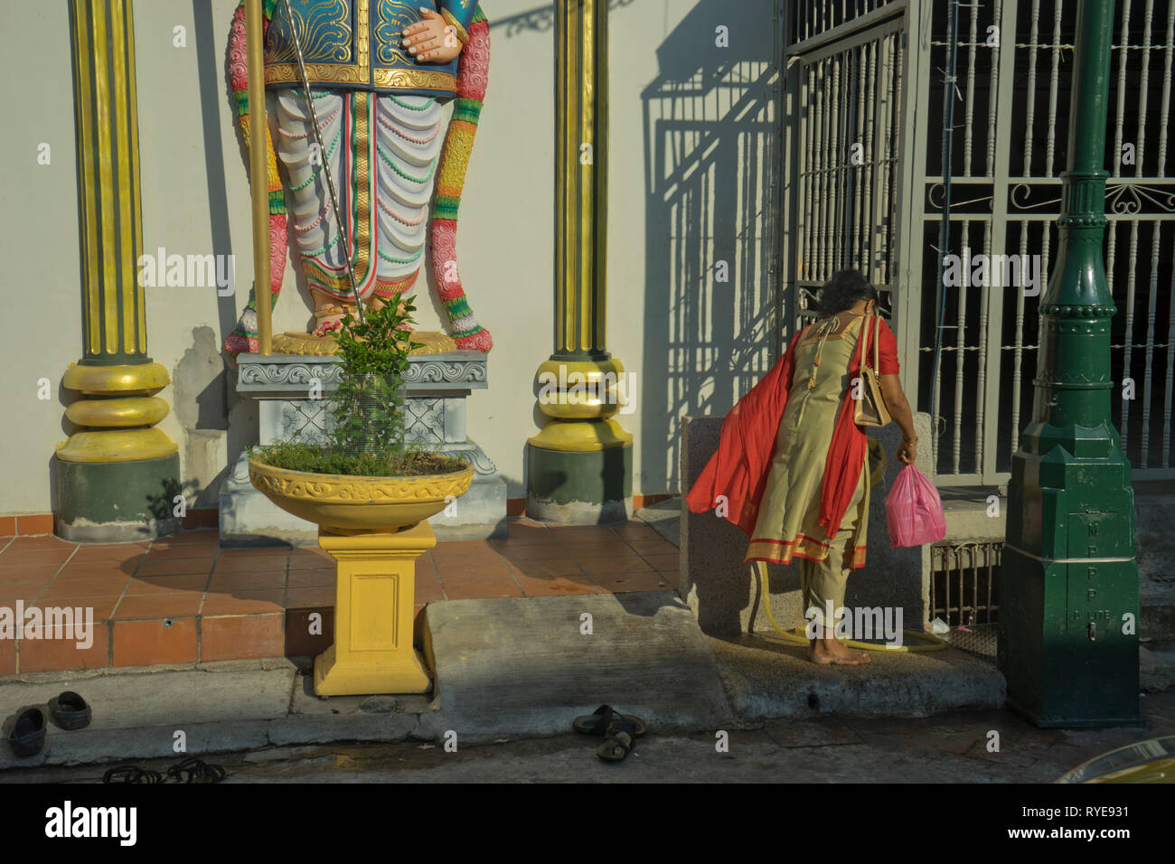 People praying at the Sri Mahamariamman Hindu Temple in George Town ...
