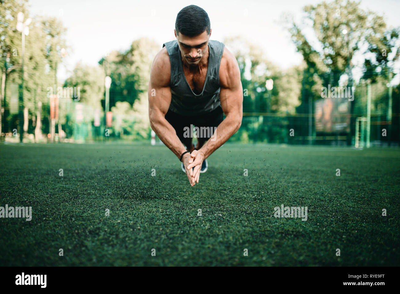 Athlete on training, push-up exercise in action Stock Photo - Alamy