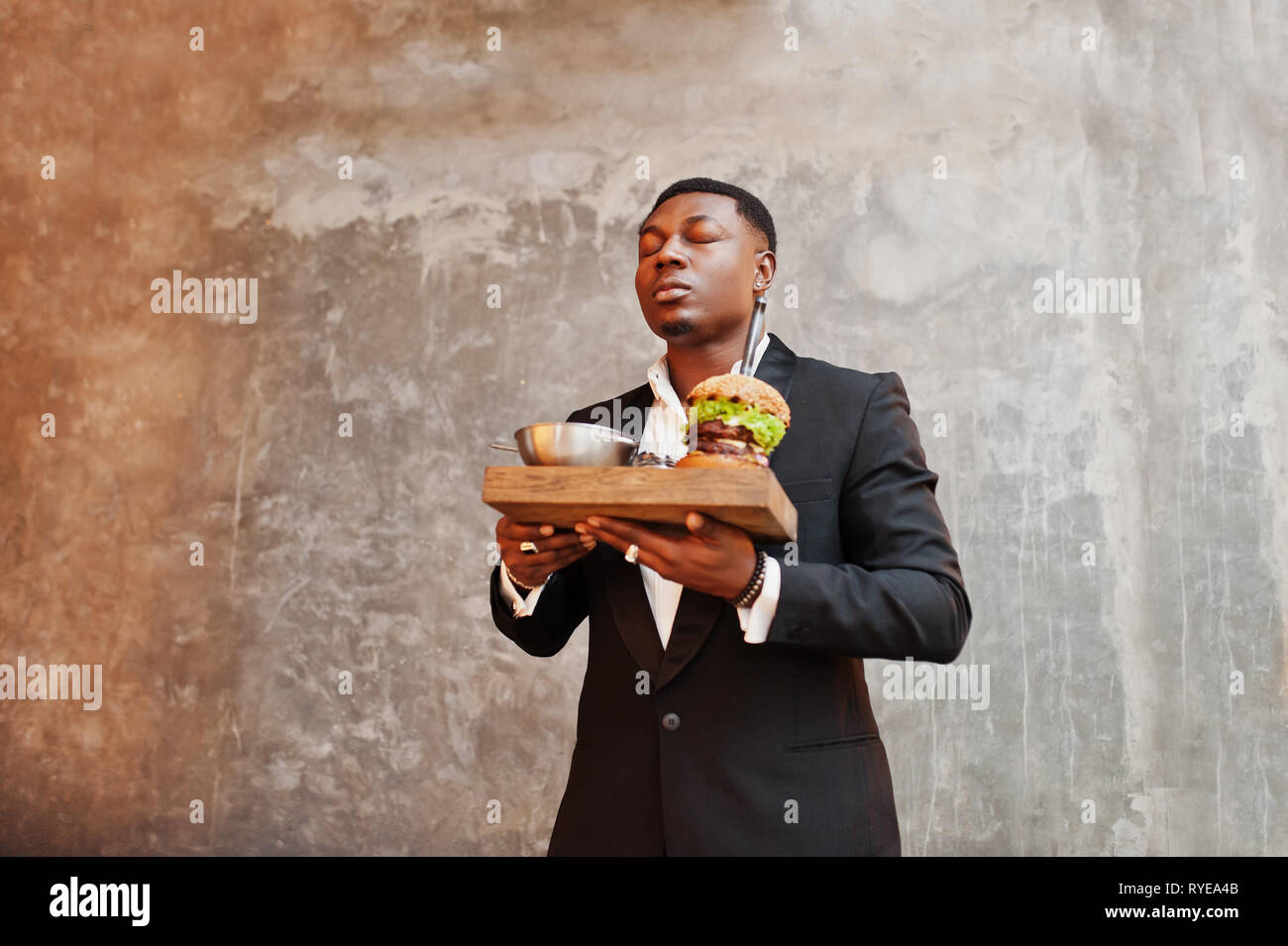 Fat man eating suit hi-res stock photography and images - Alamy