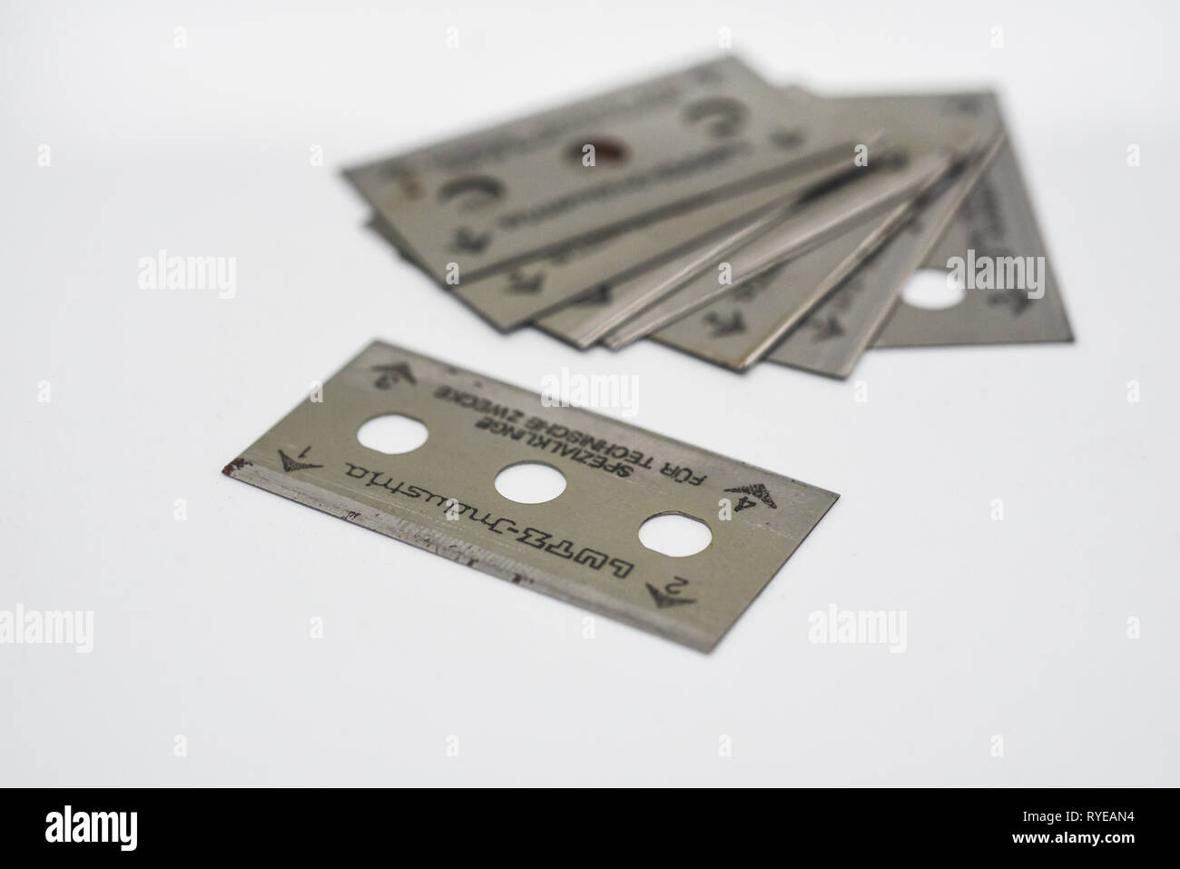 Close up view of metallic razors blade isolated on white background ...