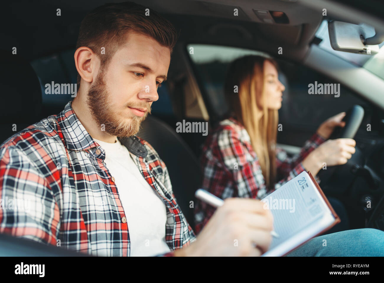 Male instructor and female student, driving lesson Stock Photo - Alamy