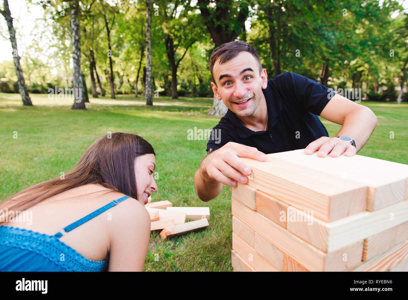 Group game of physical skill with big blocks Stock Photo - Alamy