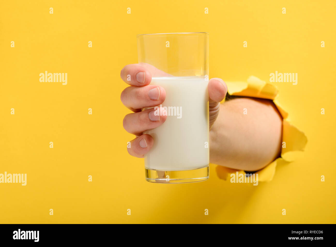 Hand giving a glass Stock Photo - Alamy