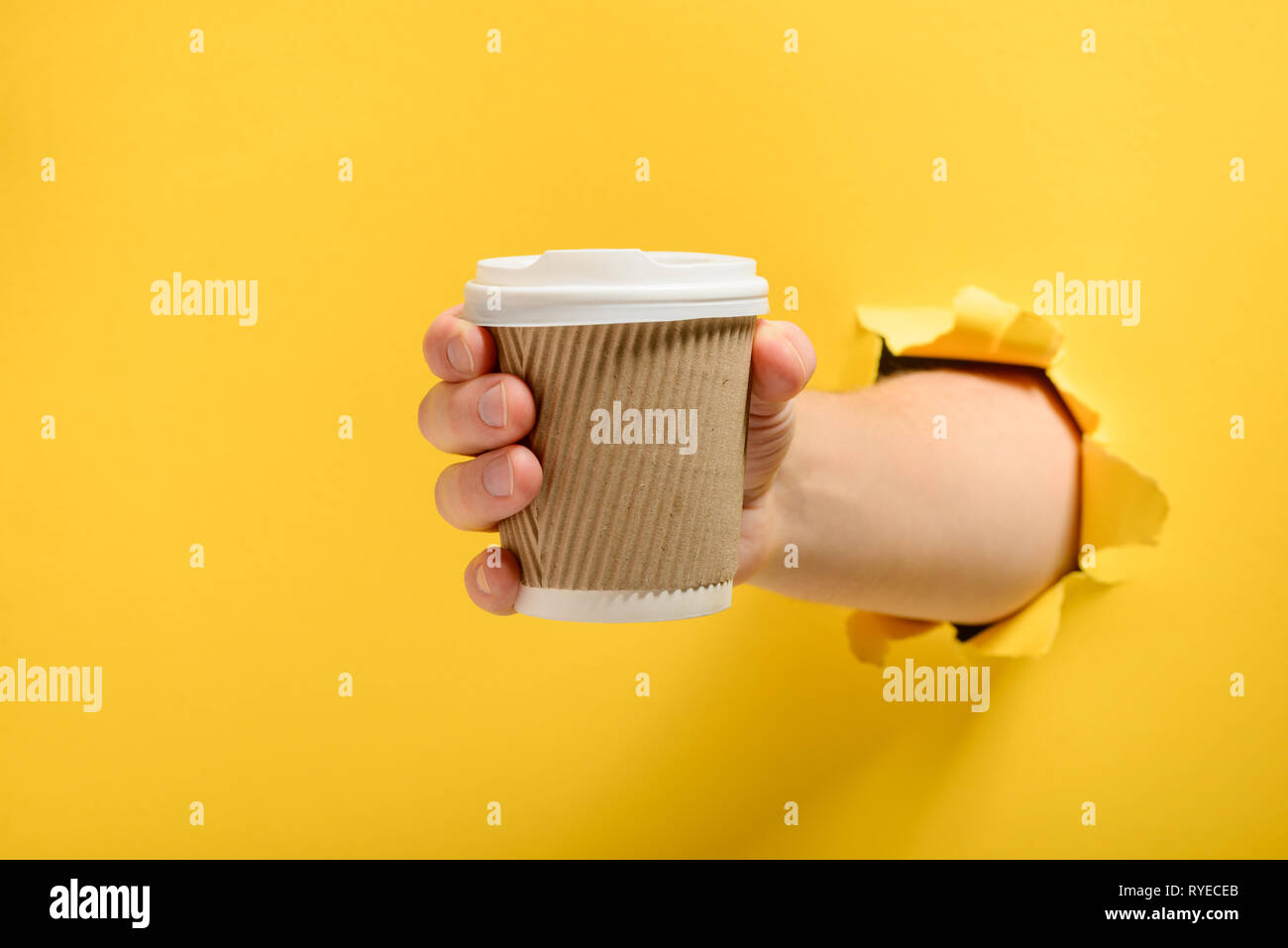 Hand taking a cup Stock Photo - Alamy