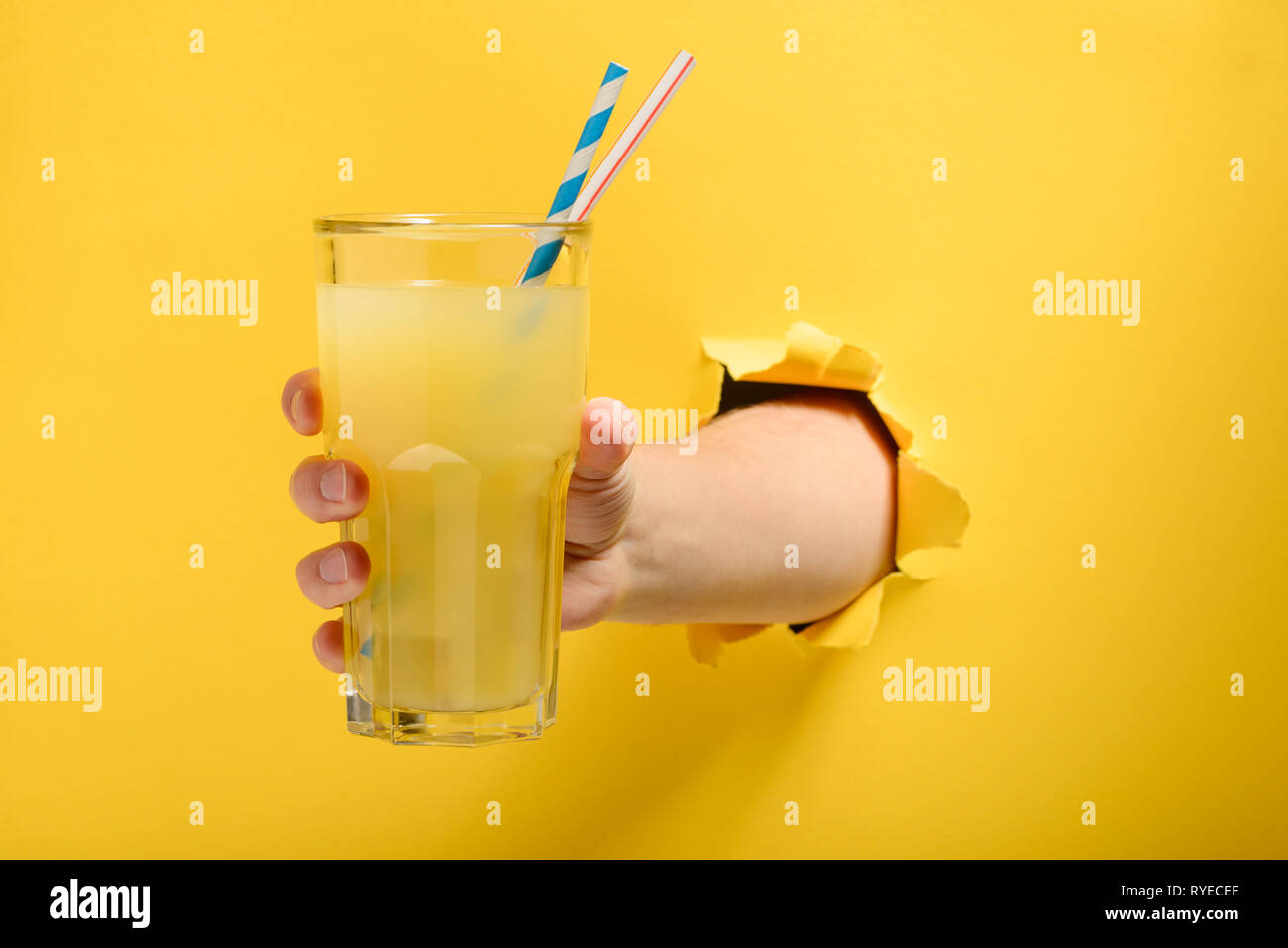 Hand giving a glass Stock Photo - Alamy