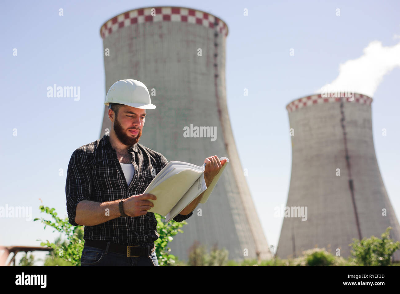 Portrait of an architect builder, serious civil engineer working with ...