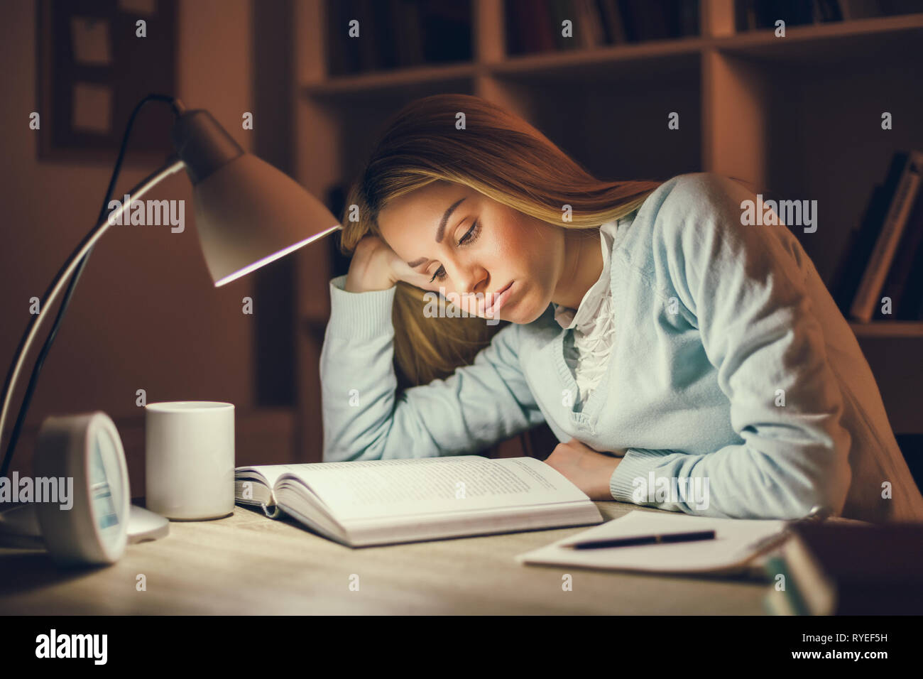 Tired student learning at home Stock Photo - Alamy