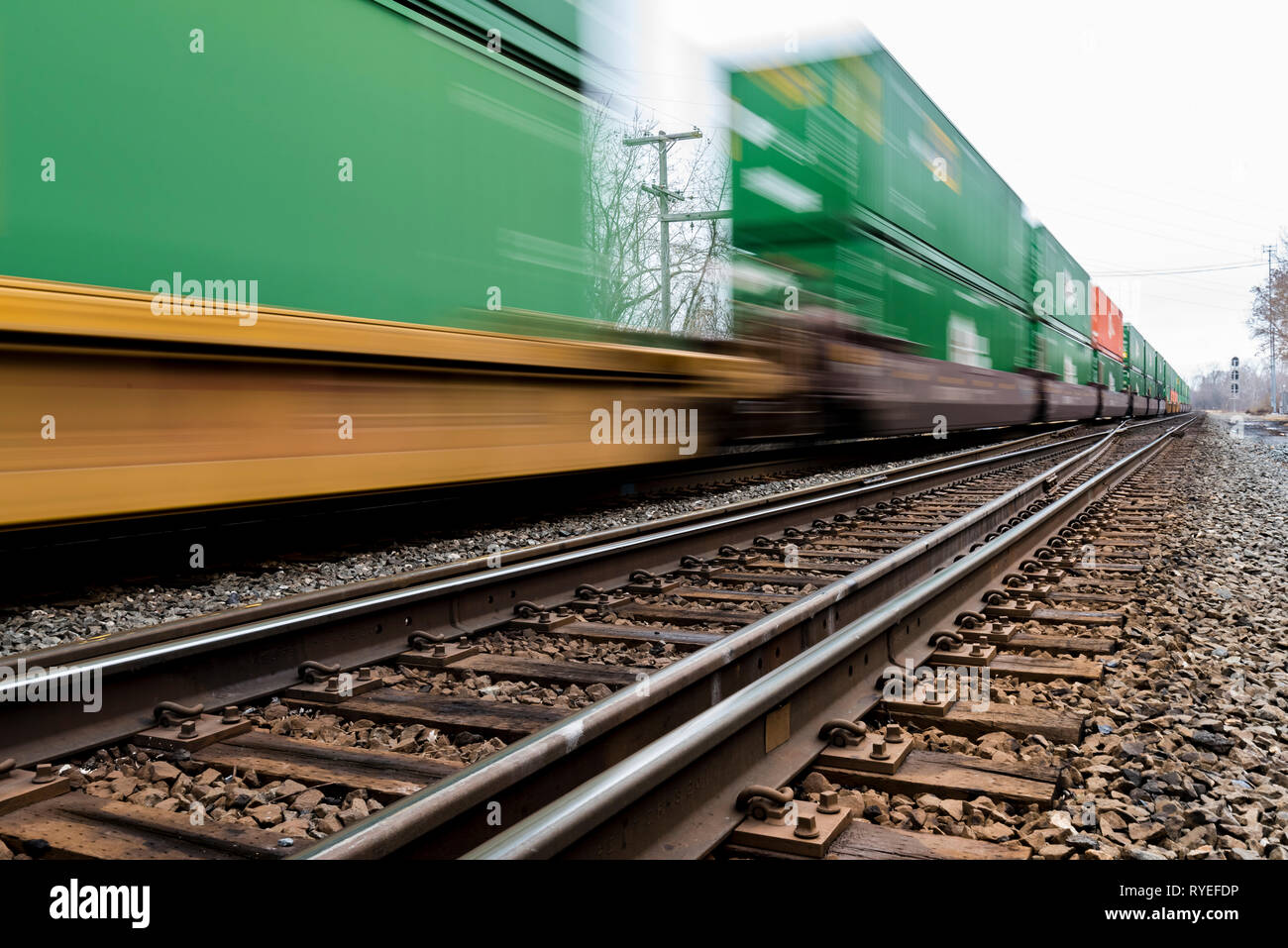 moving train moving away on train tracks Stock Photo - Alamy