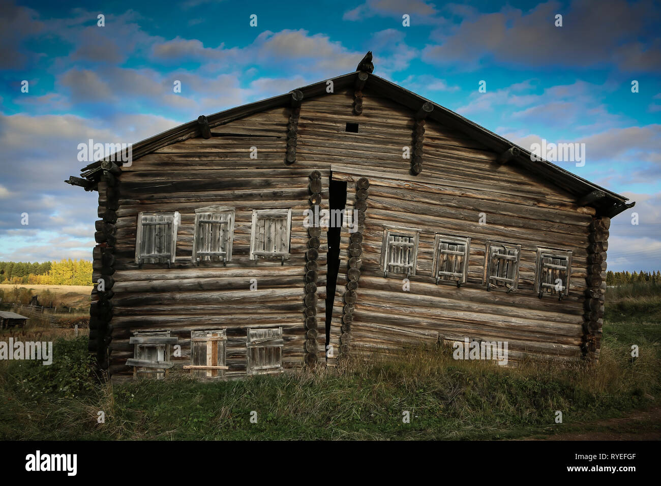 Front view of wooden log house in Russian village on a sunny day ...